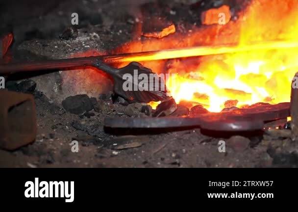 Blacksmith forging red hot iron Stock Videos & Footage - HD and 4K ...