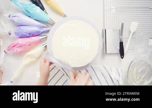 Step by step. Top view. Pastry chef stacking cake layers with ...