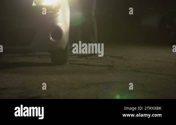 Rich man in business suit buying drugs from dealer near car at night ...