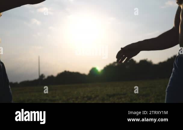 Friendly handshake of two unrecognizable muscular white men with sun ...