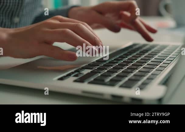 Close up woman typing on the laptop keyboard. Female hands typing on ...