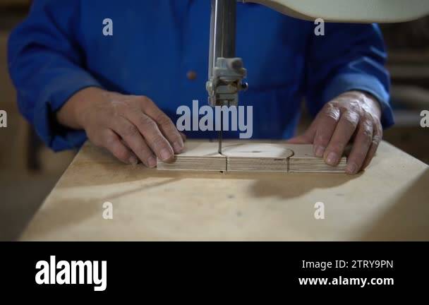 employee drills the item in the workshop with the help of a drilling ...