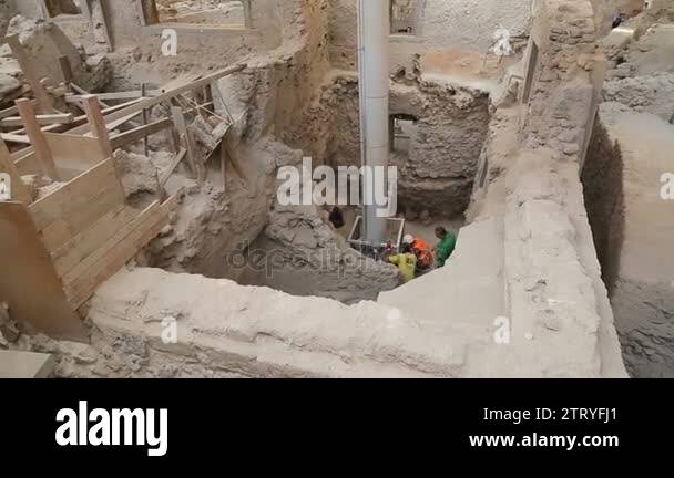 Construction workers fixing problem down at preservation site of old ...