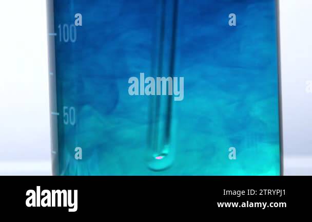 Texture and processes inside a glass flask with liquid. Water and ink ...