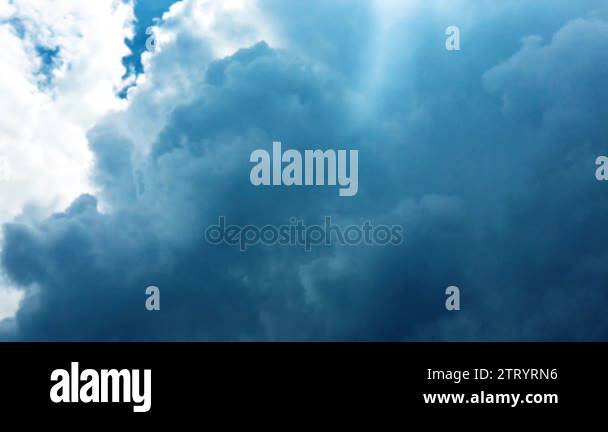 White clouds disappear in the hot sun on blue sky. Time-lapse motion ...