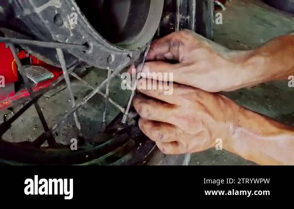 Repairing a wheel Stock Videos & Footage - HD and 4K Video Clips - Alamy