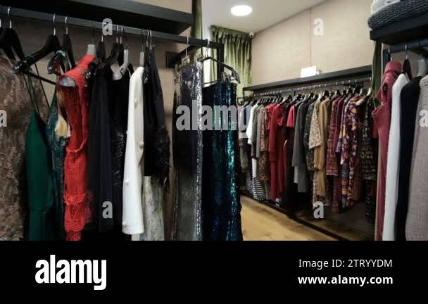 Shooting Three rows of hangers along walls clothes in store Stock Video ...