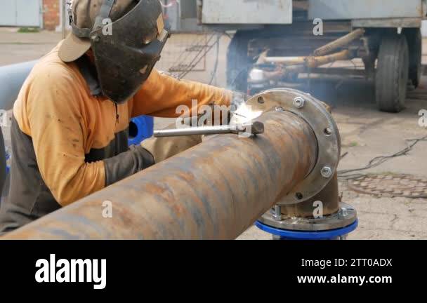 Welding pipe. Welder worker welding pipe by electrode. Electrodes for ...