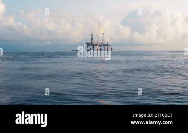 FPSO tanker vessel near Oil Rig platform. Offshore oil and gas industry ...
