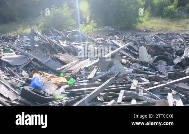 Waste dump in the town. View of garbage dump among block of flats. Heap ...
