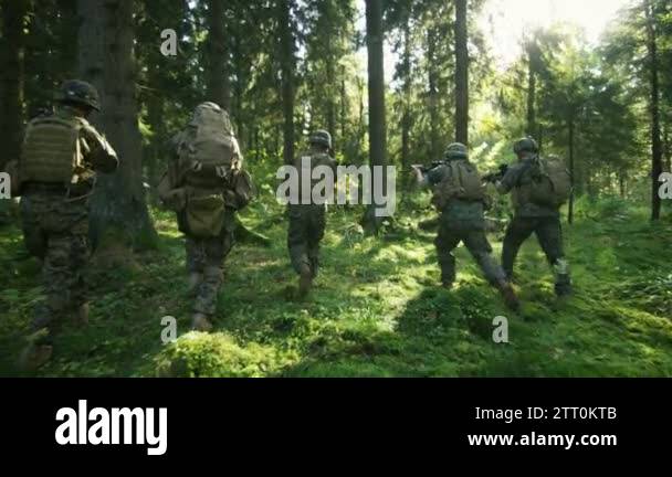Squad of Five Fully Equipped Soldiers in Camouflage on a Reconnaissance ...