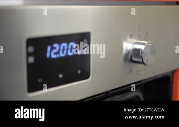 Metallic Toggle Switch of the Cooker Oven. Close-up View. Digital Clock ...
