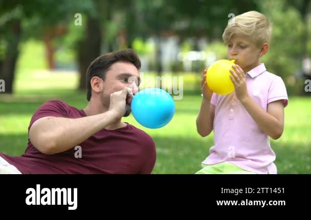 People blowing up balloons outdoor Stock Videos & Footage - HD and 4K ...