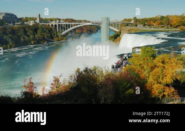 The observation deck near the famous Niagara Falls. Tourists admire the ...