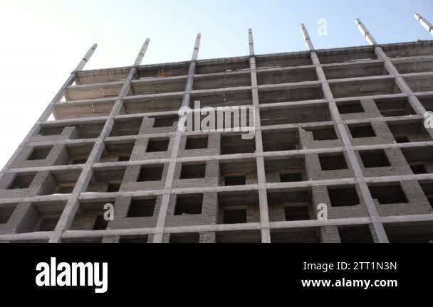 Multi-storey residential building under construction. Front view ...