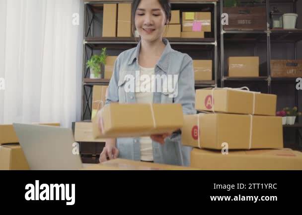 Beautiful smart Asian young entrepreneur business woman owner of SME ...