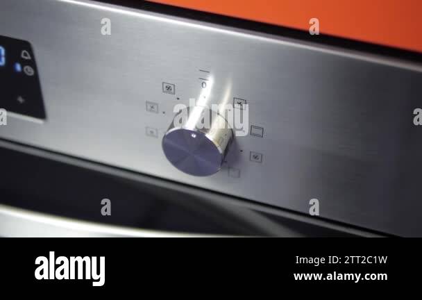 Metallic Toggle Switch of the Cooker Oven. Close-up View. Digital Clock ...