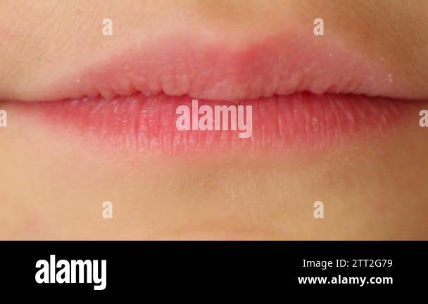 Lips closeup, mouth opens, and there are baby teeth Stock Video Footage ...