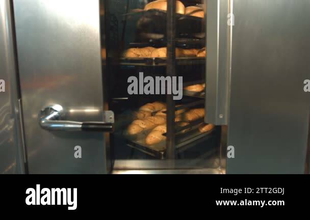 Pastries on a tray.Process of baking in the oven. Bread and baguettes ...