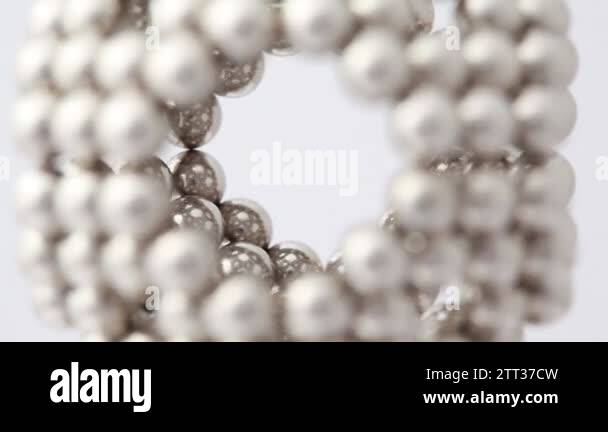 Magnet balls in spherical structure with hexagonal cells Stock Video ...