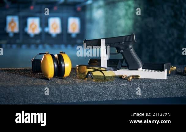 Shooting equipment on a targets background. Ammunition, guns, weapons ...