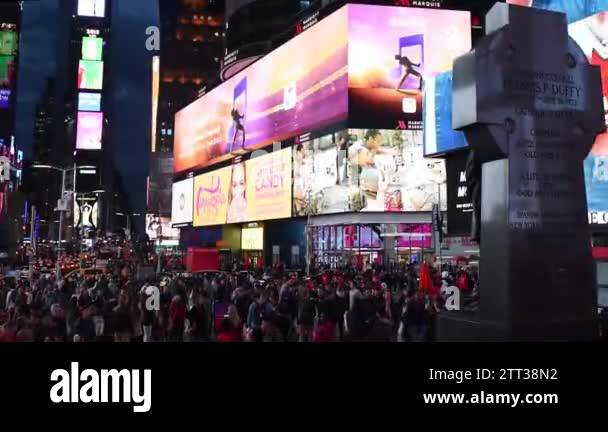 Times Square at night.Cars riding and pedestrians walk on Times Square ...