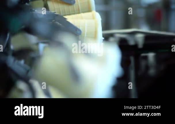 Manufacturing line at food factory. Ice cream manufacturing process ...