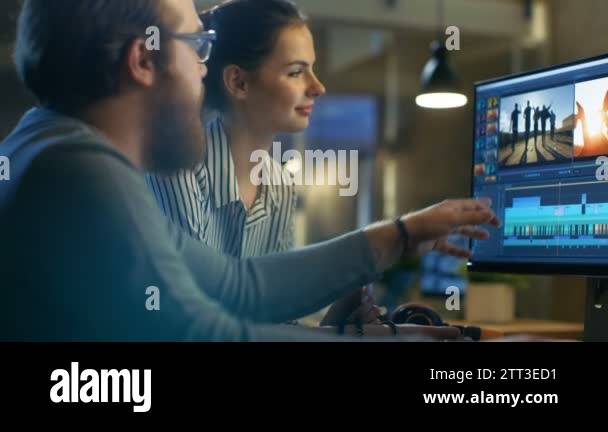 Female and Male Video Editors Work With Footage and Sound on Their ...