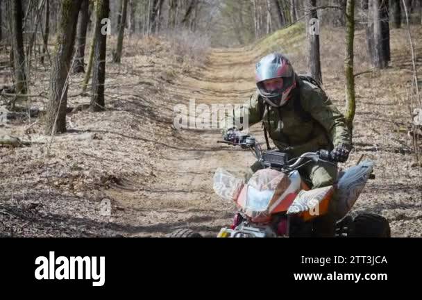 Extreme vacation in the woods on the ATV. Men engage in motor sport ...