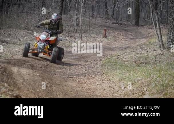 Extreme vacation in the woods on the ATV. Men engage in motor sport ...