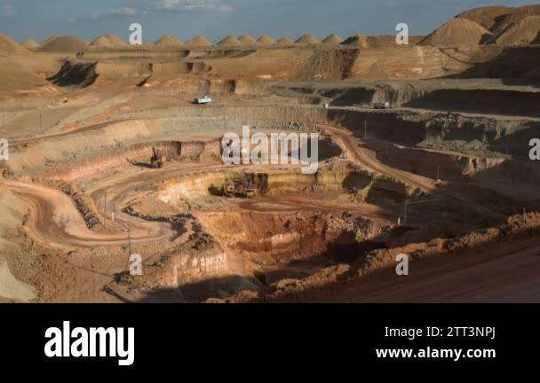 Time lapse. Excavators load ore into dump-trucks. This area has been ...