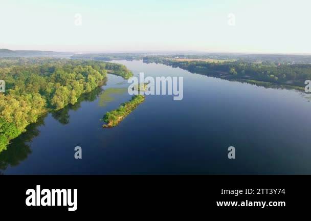 fly over island on the river 4K, 4K aeria view of island with reed ...