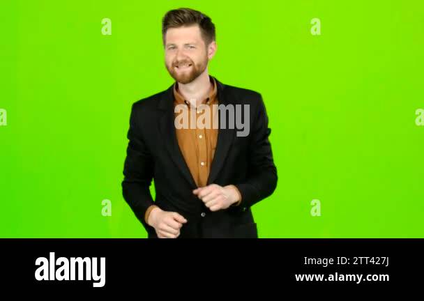 Male actor smiles, showing them different grimaces and language. Green ...
