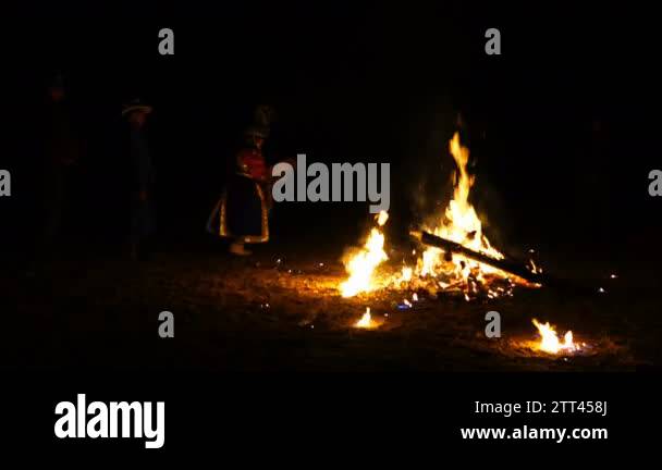 Mongolian shaman performs a ritual in the night at the sacred fire in ...