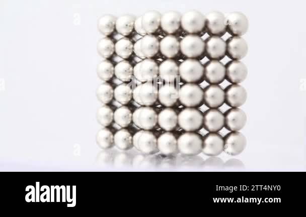 Magnet balls in prismatic wave structure with hexagonal cells Stock ...