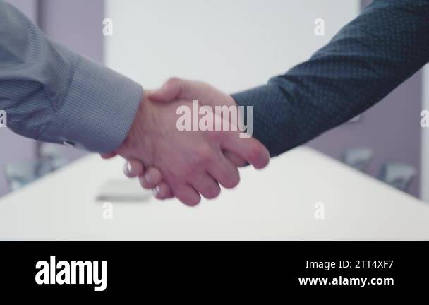 three options handshake of two businessmen 4K unrecognizable close-up ...