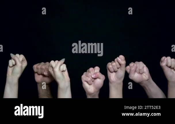 Crowd hands with sign of victory. Close-up of many hands with fists ...
