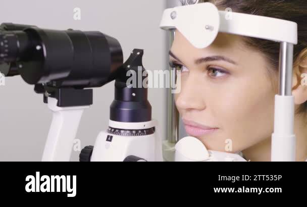 video of woman checking eyes, Slit lamp examination of eyes in ...