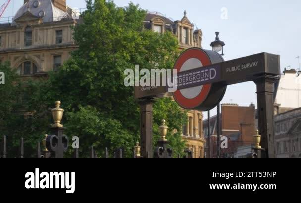 London, England - 23rd June 2017: The Classic London Underground Sign with tourists and people ...