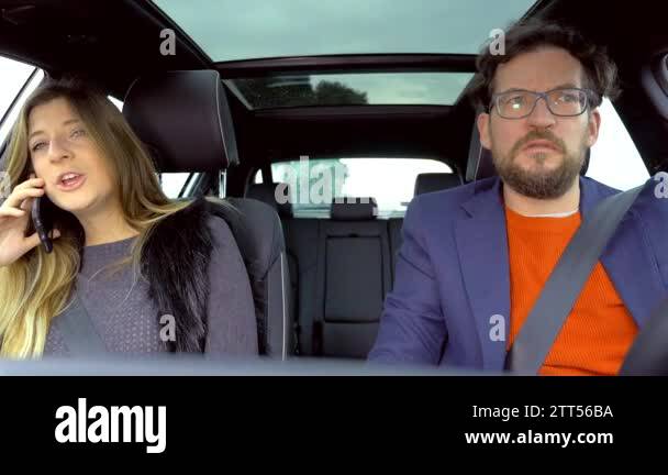 Father driving car getting angry with daughter talking on the phone ...