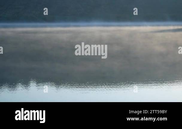 Fog spreads over the water.Panorama (from left to right) on the fog ...