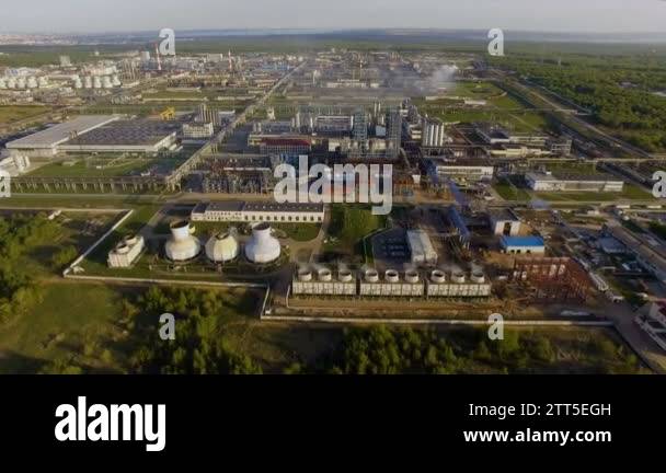 A huge oil refinery with pipes and distillation of the complex on a ...