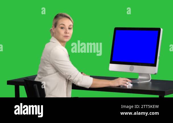 Young pretty lady talking to the camera and showing something on the ...