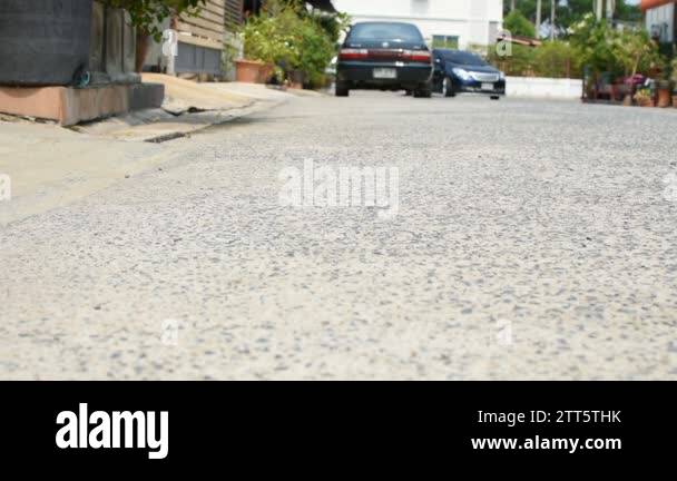 Driving a lowered car on a sloping car park Stock Video Footage - Alamy