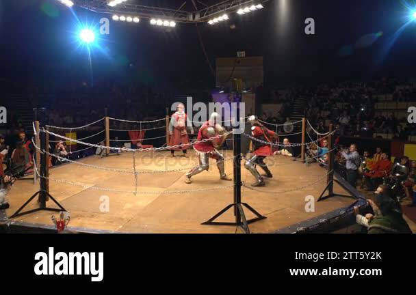Two Medieval Knight Fighting In An Arena With Swords And Shields Stock ...