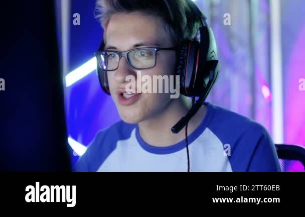 Teenage Boy Gamer Plays in Competitive Video Game on a eSports ...