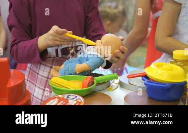 Little girl feeding her doll Stock Videos & Footage - HD and 4K Video ...