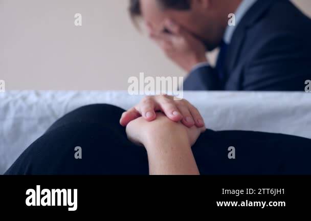 funeral, sadness and mourning concept - a sad man talking and crying ...