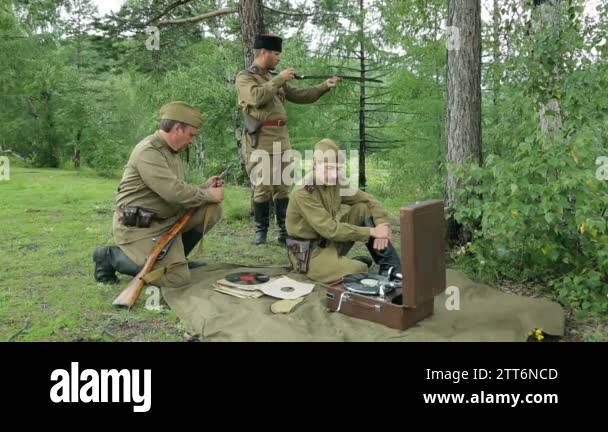 The army of the USSR. Soviet army soldiers are resting. Soldiers listen ...