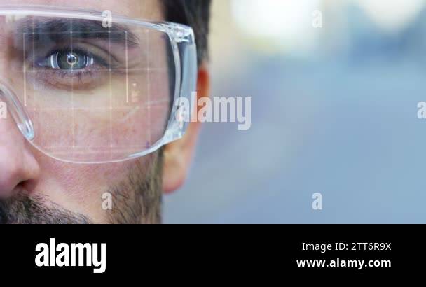 A man watches with a futuristic look with glasses augmented reality in ...